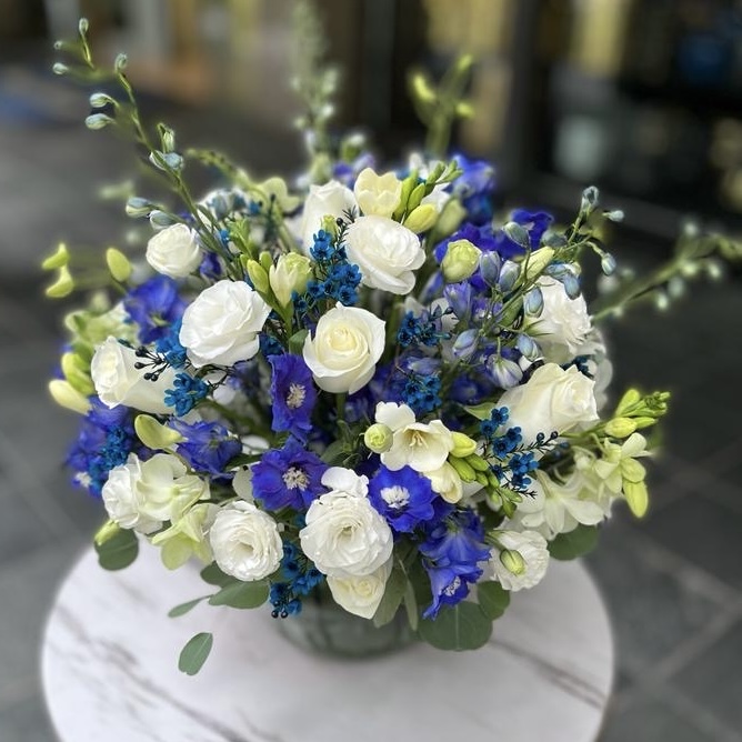 Beautiful mix of premium quality flowers arranged in a stylish vase.