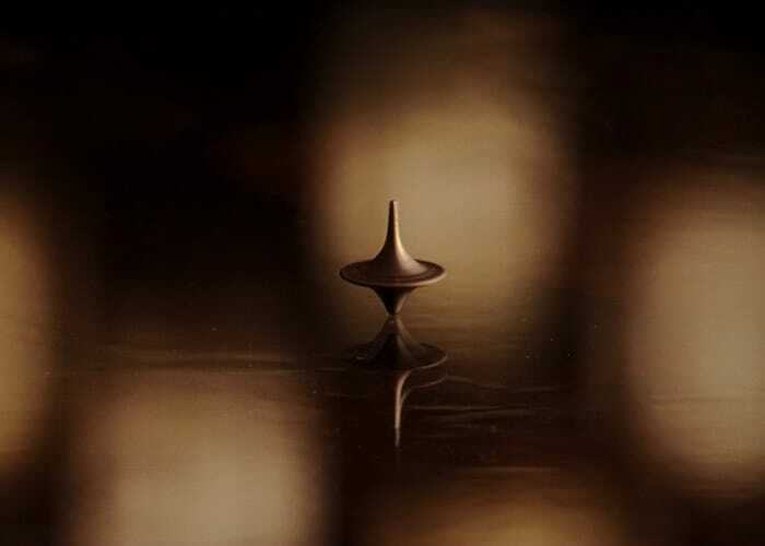 The point of Christopher Nolan's "Inception": did the spinning top fall?