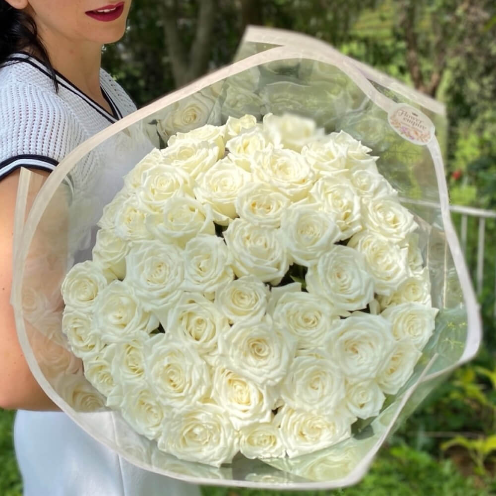 Beautiful bouquet of premium roses arranged in our signature style.