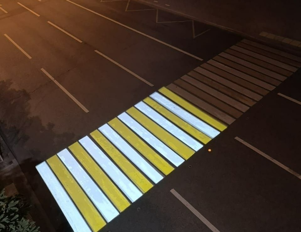 Projected crosswalk and road signs. In Dubai, Abu Dhabi, UAE and ...