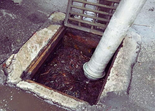 What should you do to prevent a clogged catch basin?